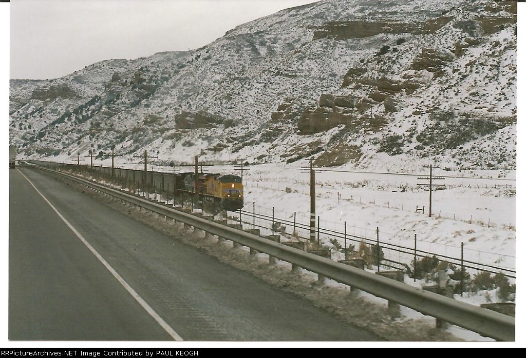 UP 7741 pulls the grade up Echo canyon with an empty coal train